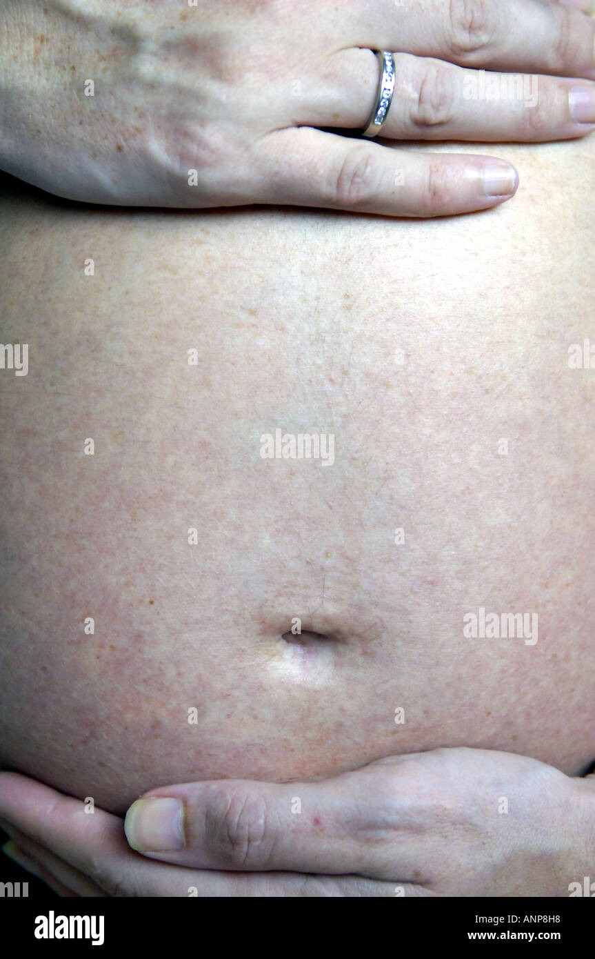 pregnant woman female bump stomach caucasian young detail close up ...
