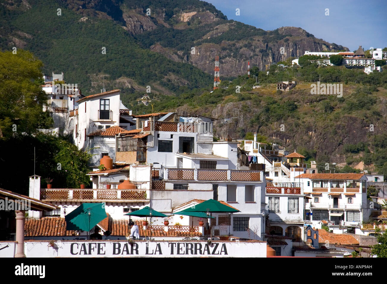 Rooftop cafe and tile roofed homes at Taxco in the State of Guerrero ...