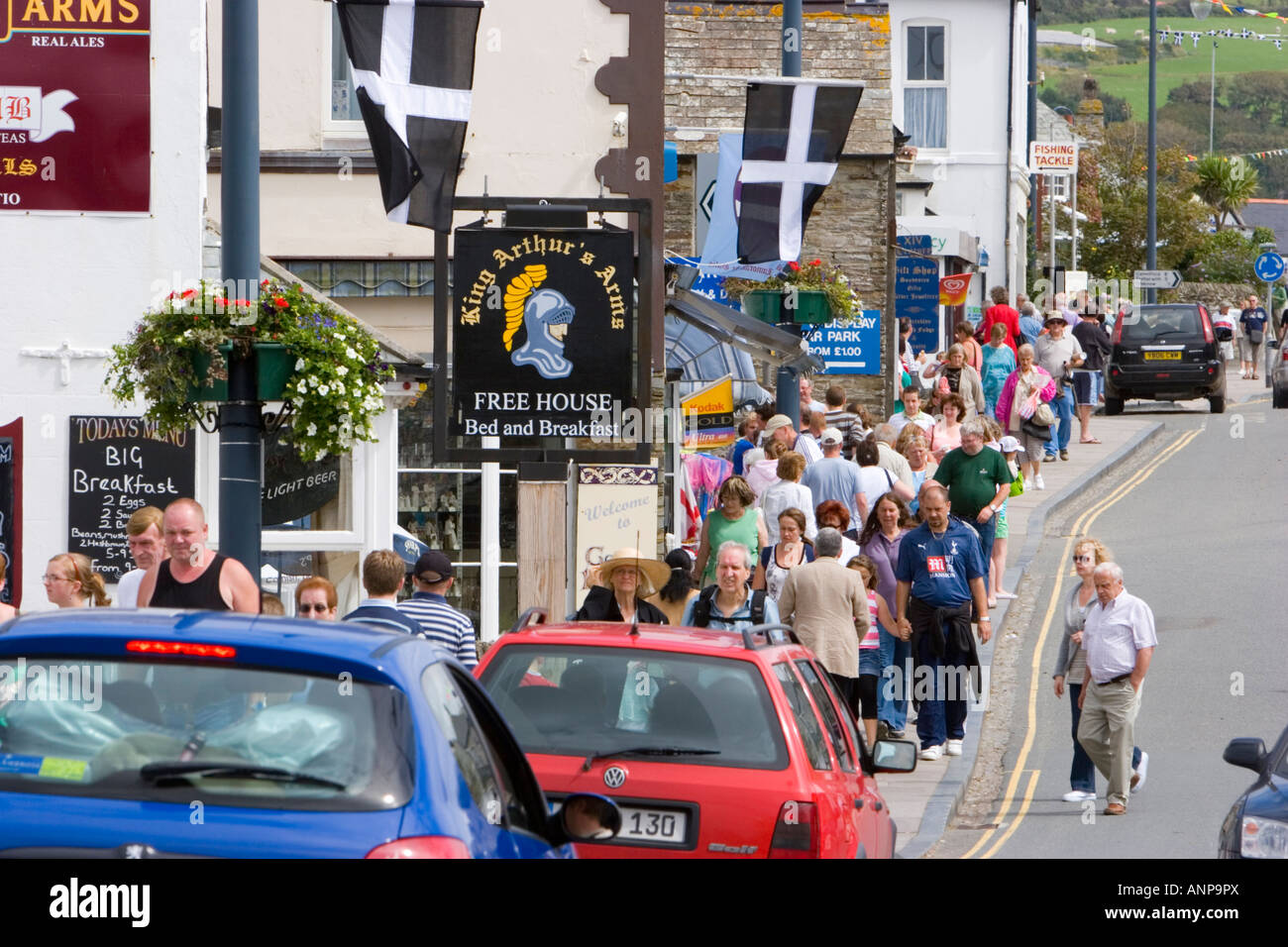 Street scene in Tintagel North Cornwall showing crowds of visitors and ...