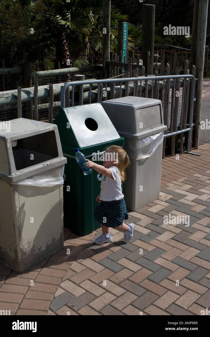 Little Girl Disposing of Garbage Stock Photo - Alamy