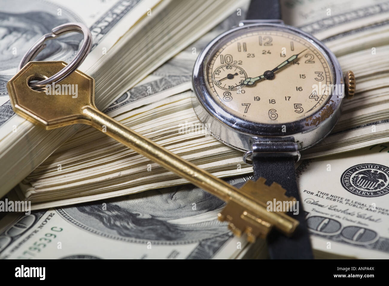 Conceptual keys to success of time and money Stock Photo - Alamy