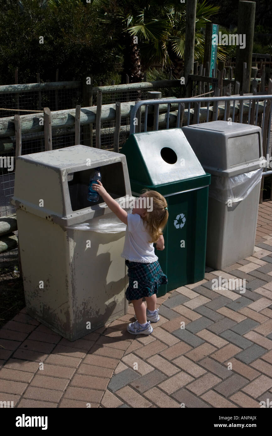 Little Girl Disposing of Garbage Stock Photo - Alamy