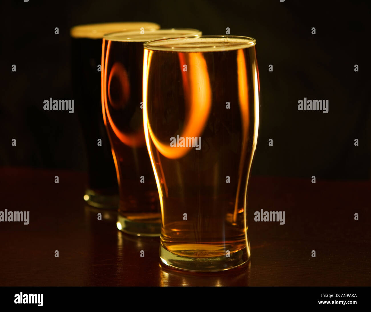 Three pints of beer Stock Photo - Alamy