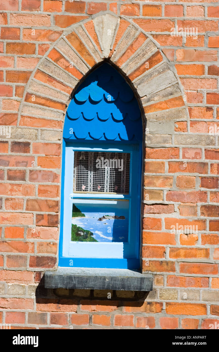 An attractive period window with blue painted frame and pointed ...