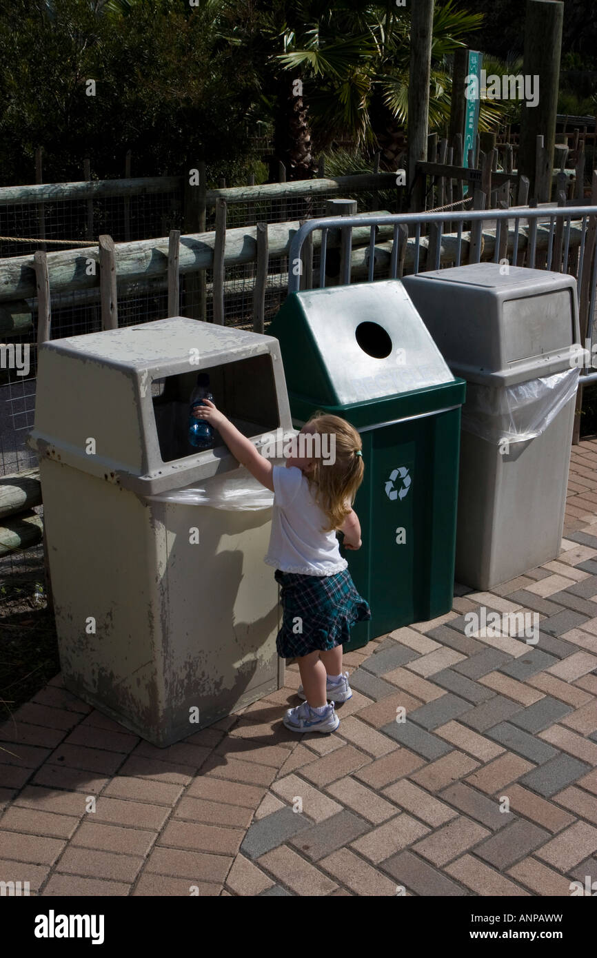 Little Girl Disposing of Garbage Stock Photo - Alamy