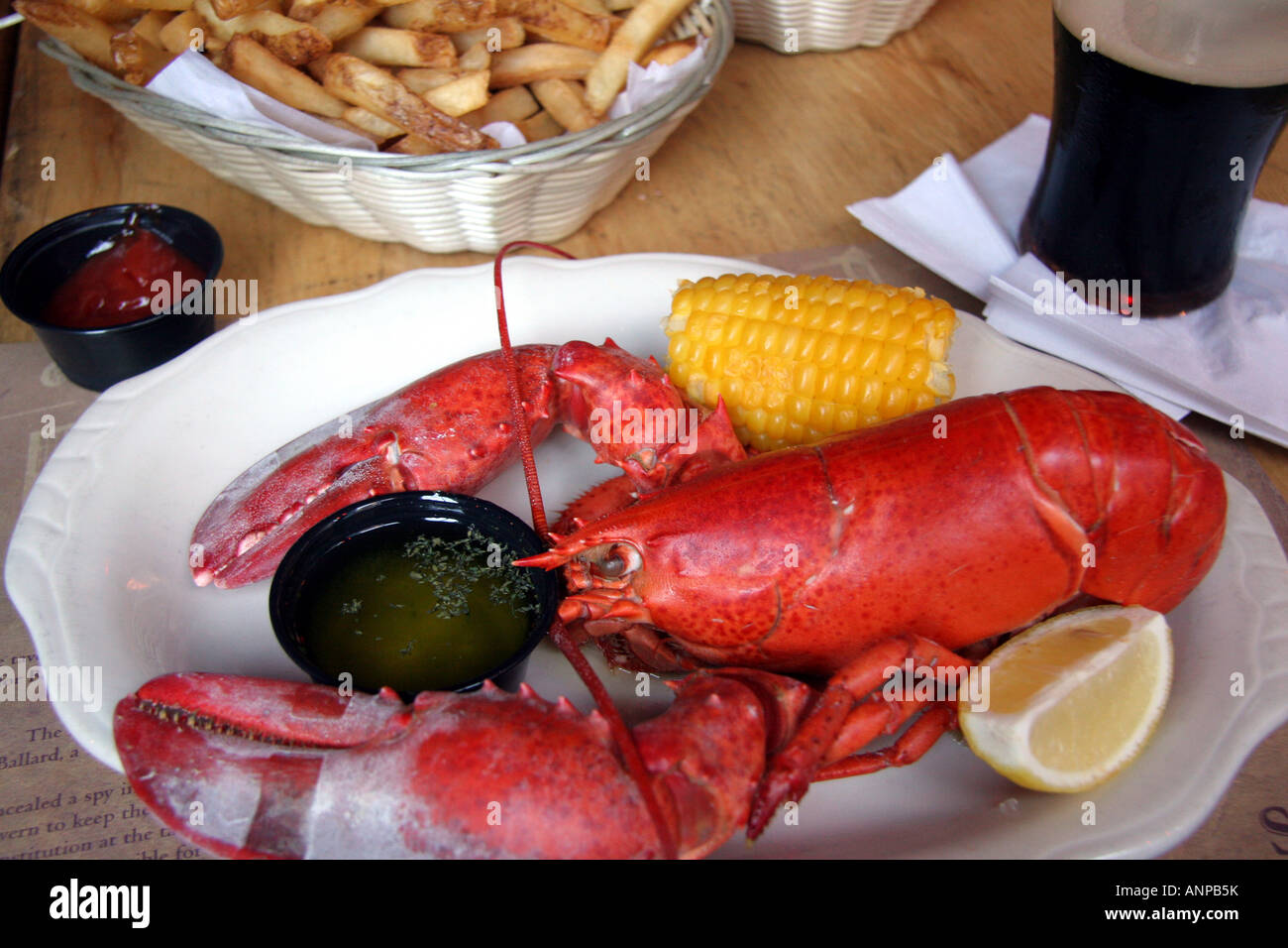 New England lobster pint of Guinness and chips Stock Photo - Alamy