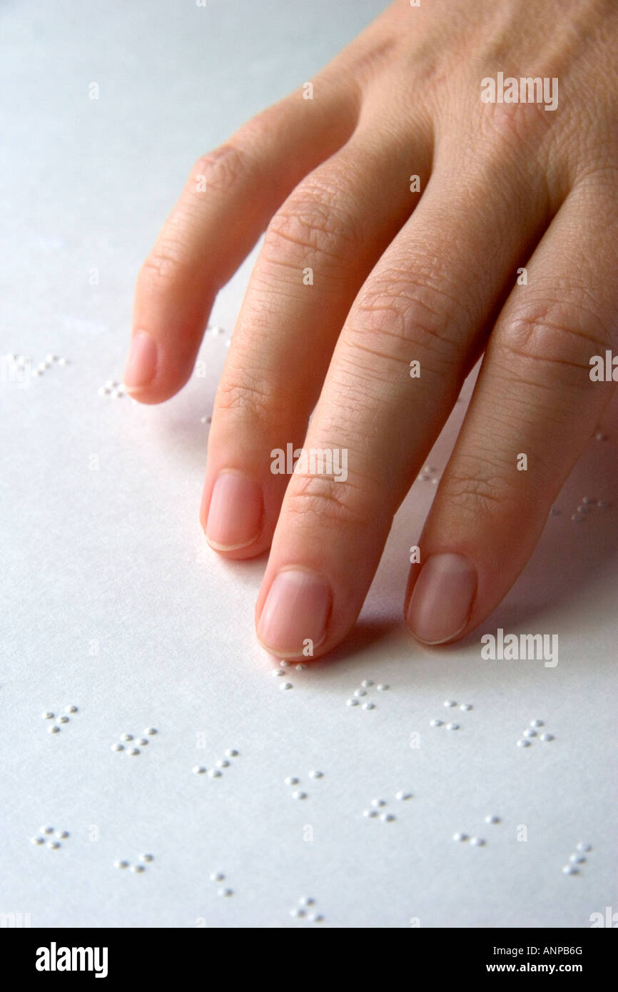 Hand reading braille Stock Photo - Alamy