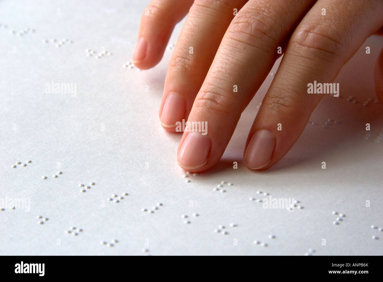 Hand reading braille Stock Photo - Alamy