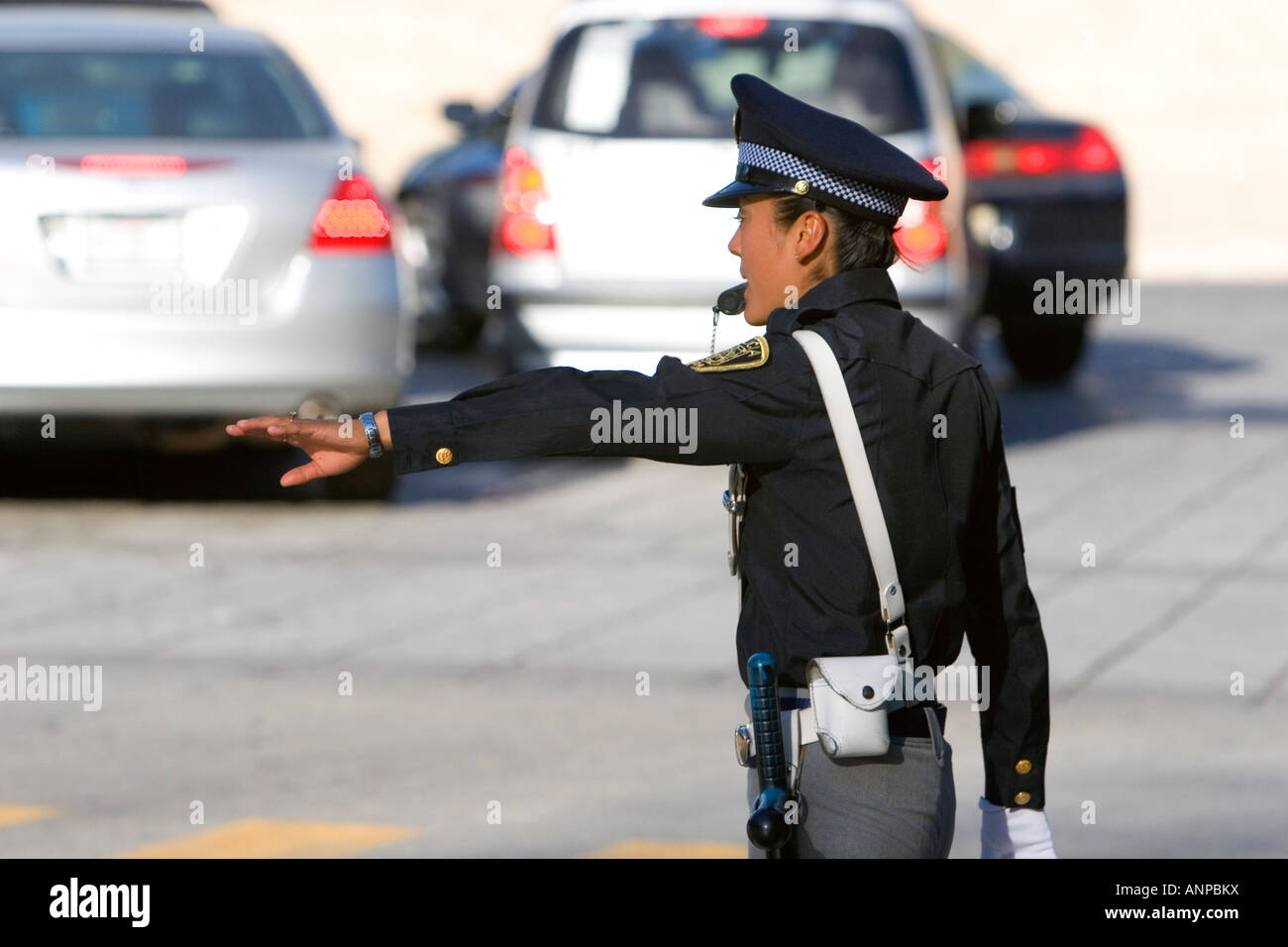 Female police officer directing traffic in Mexico City Mexico Stock ...