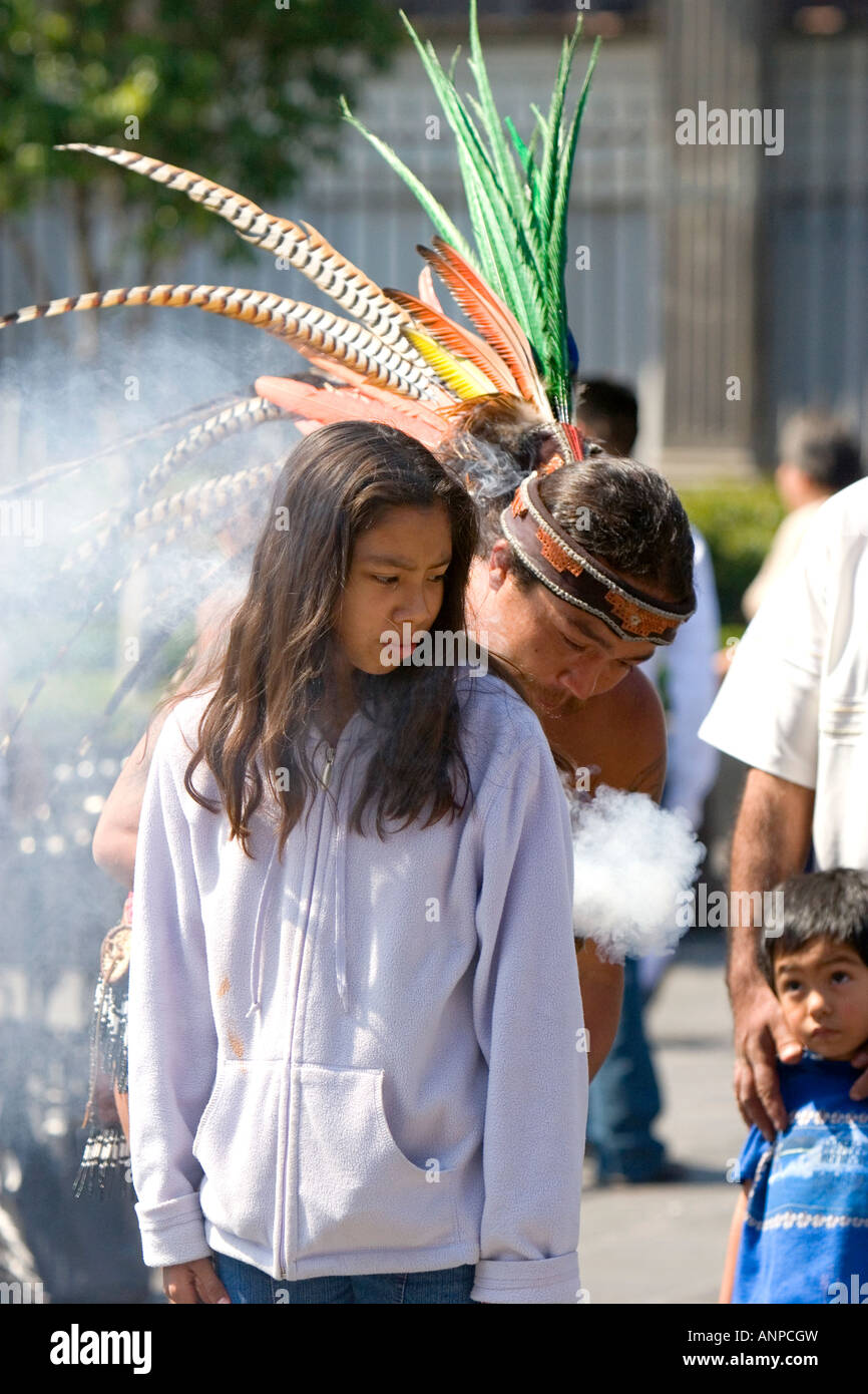 Aztec indian in traditional dress performing a spiritual ceremony with ...
