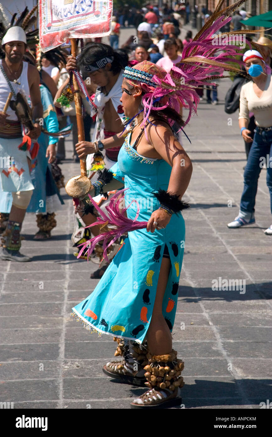 Aztec indian woman in traditional dress performing Los Concheros dance ...