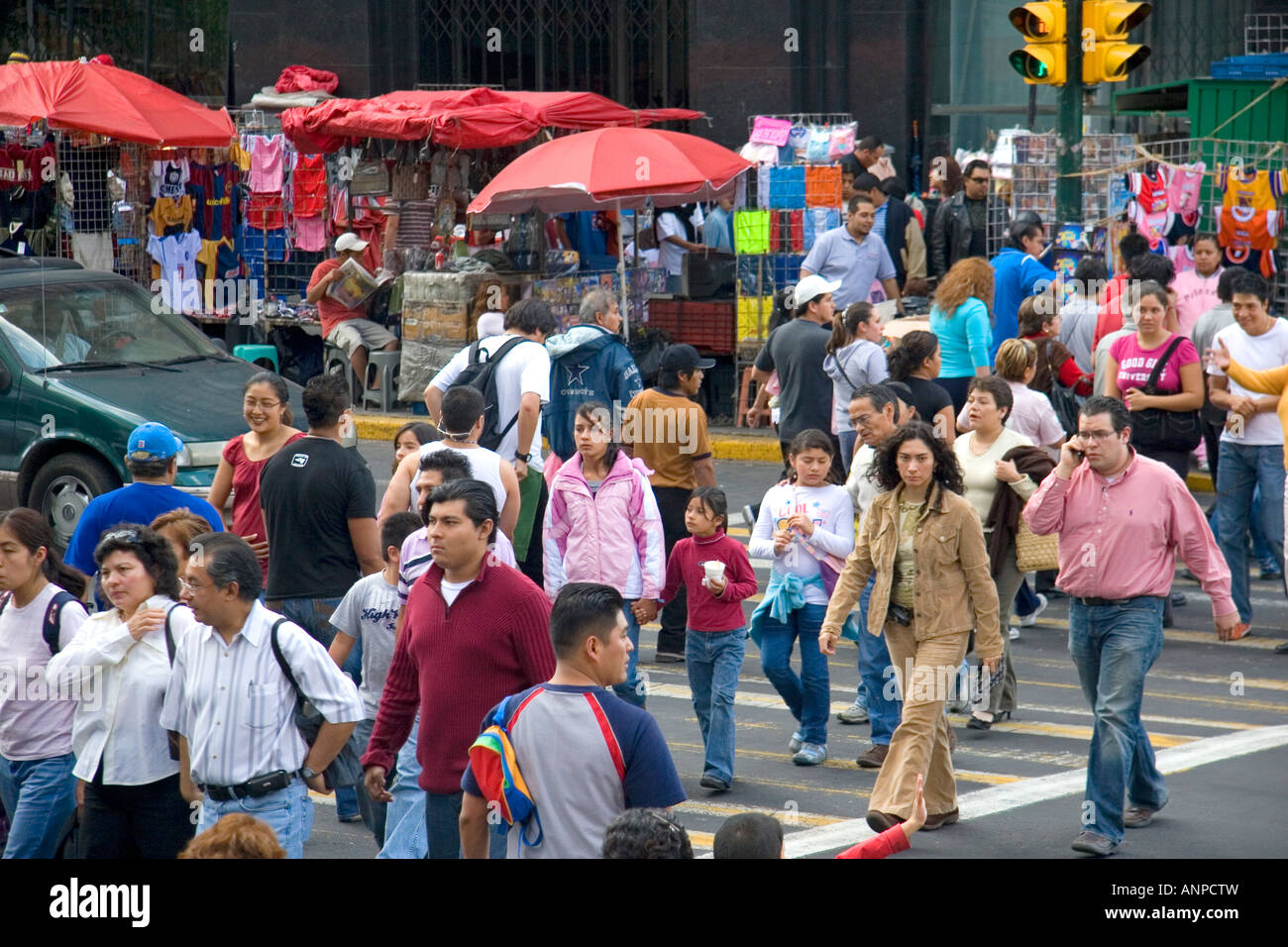 Pedestrians cross the street at the intersection of Paseo de la Reforma ...