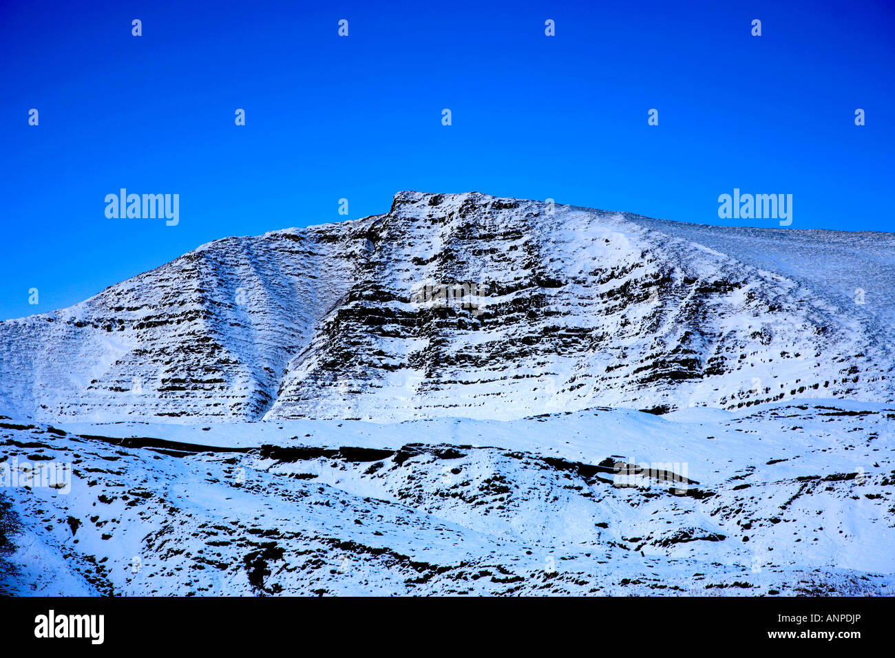 Winter snow covering Mam Tor from Hope Valley Peak District National ...