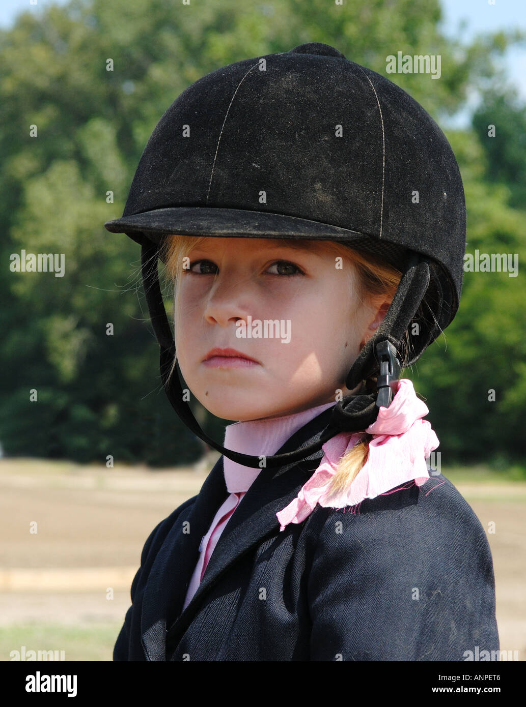 Black child riding horse helmet hi-res stock photography and images - Alamy