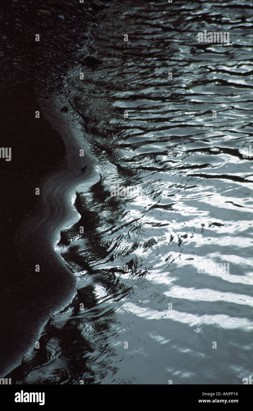 water running ashore Stock Photo - Alamy