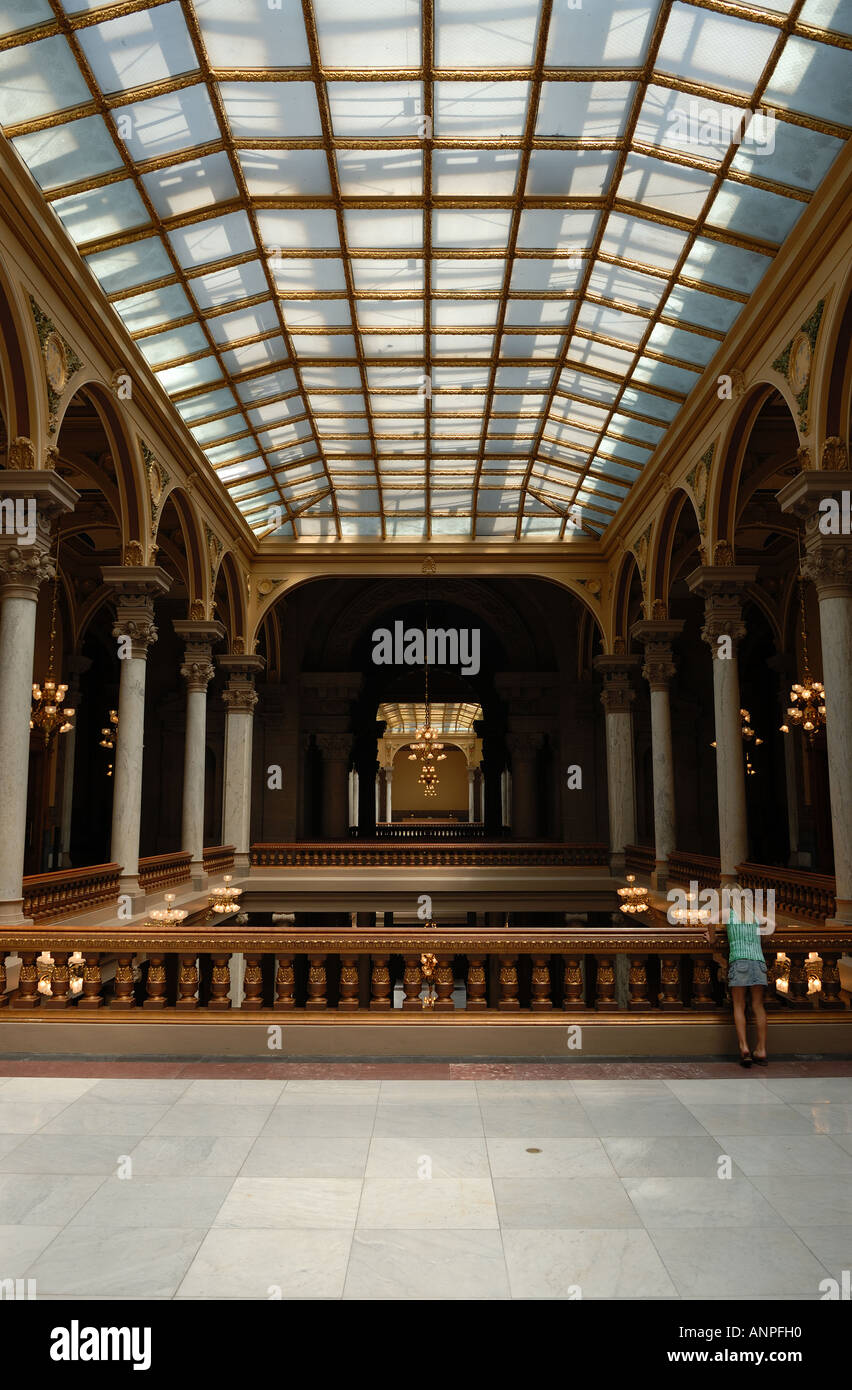 Interior of government building with young girl looking over the ...