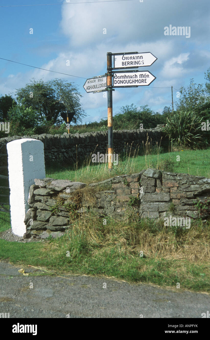 Traditional Irish Sign posts on stone wall, Cork, Ireland Stock Photo ...