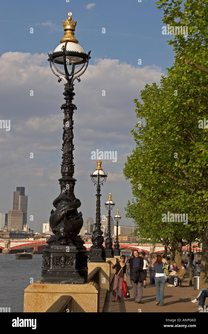 Crowds of people on a summer evening walking on Queen s Walk by River ...
