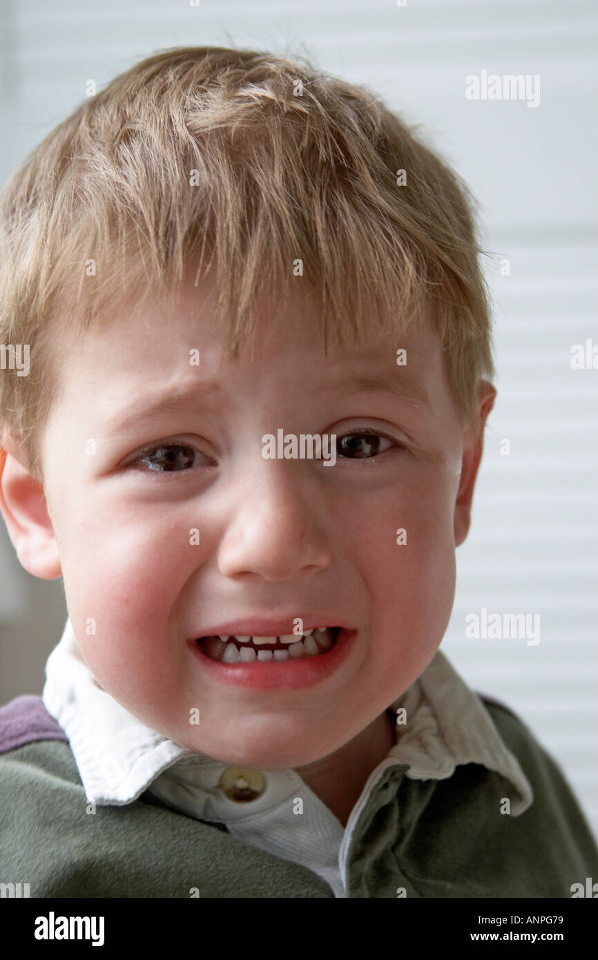 Small young boy looking sad miserable worried and crying CJWH Stock ...