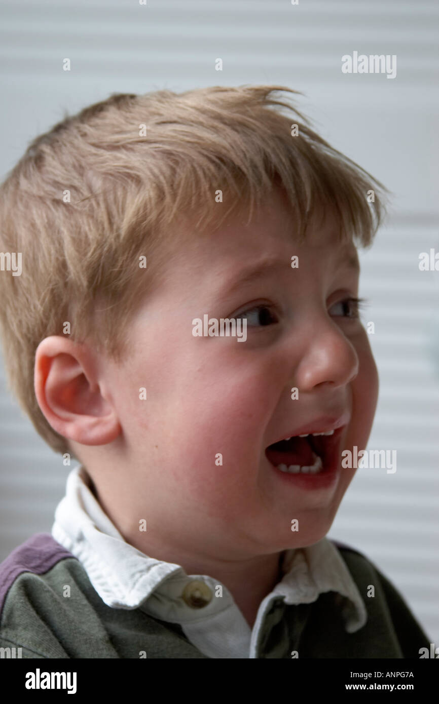 Small young boy looking sad miserable worried and crying CJWH Stock ...