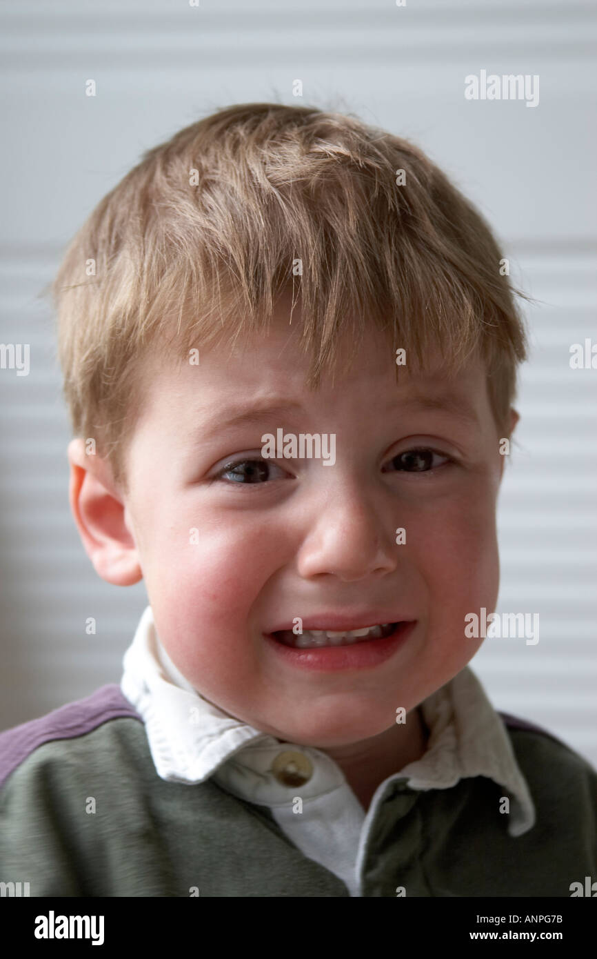 Small young boy looking sad miserable worried and crying CJWH Stock ...