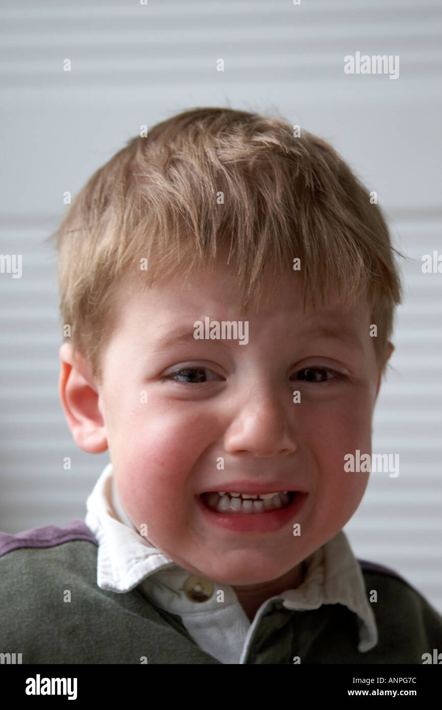 Small young boy looking sad miserable worried and crying CJWH Stock ...