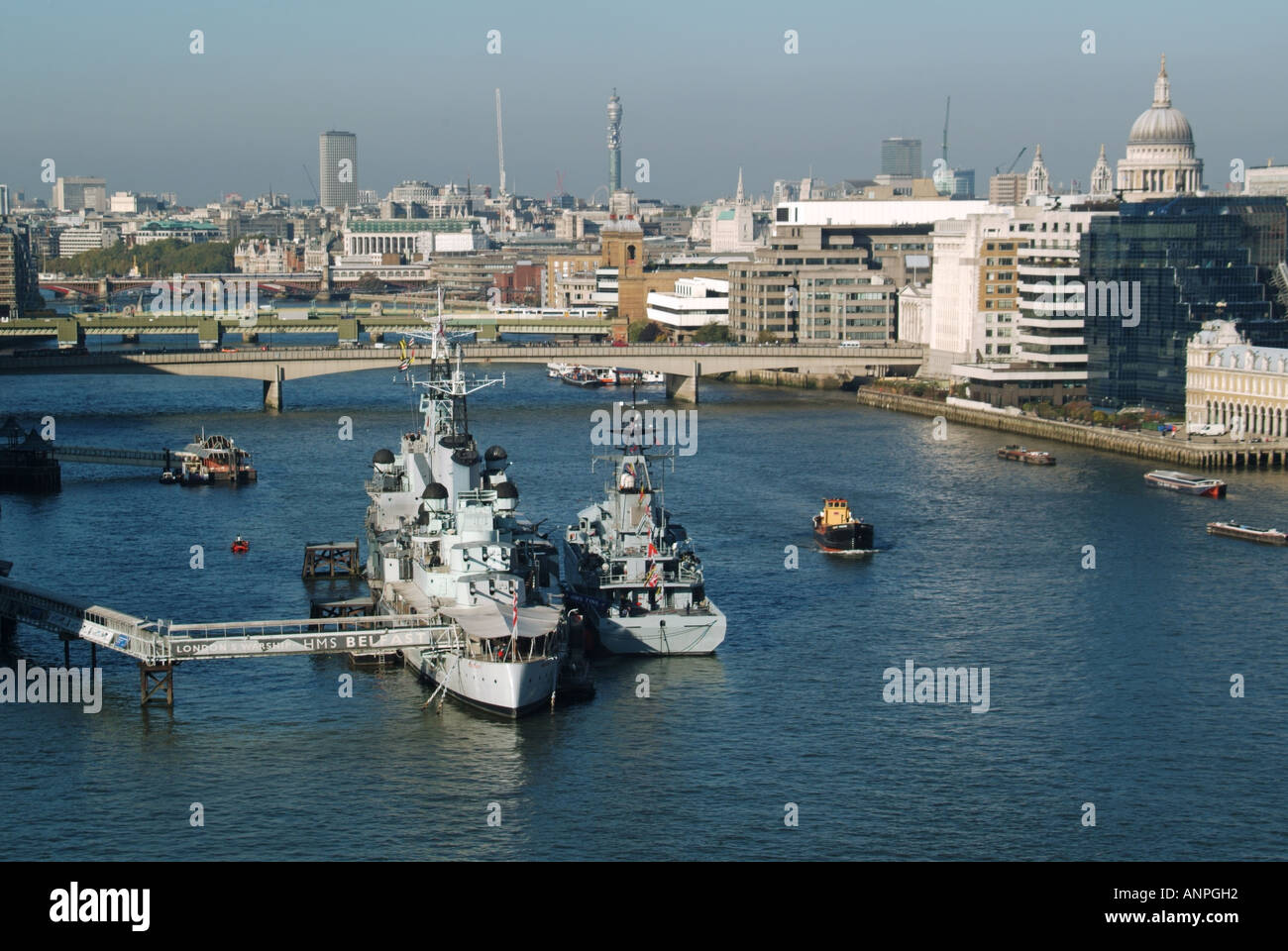 HMS Belfast cruiser moored in the pool of London with visiting River ...