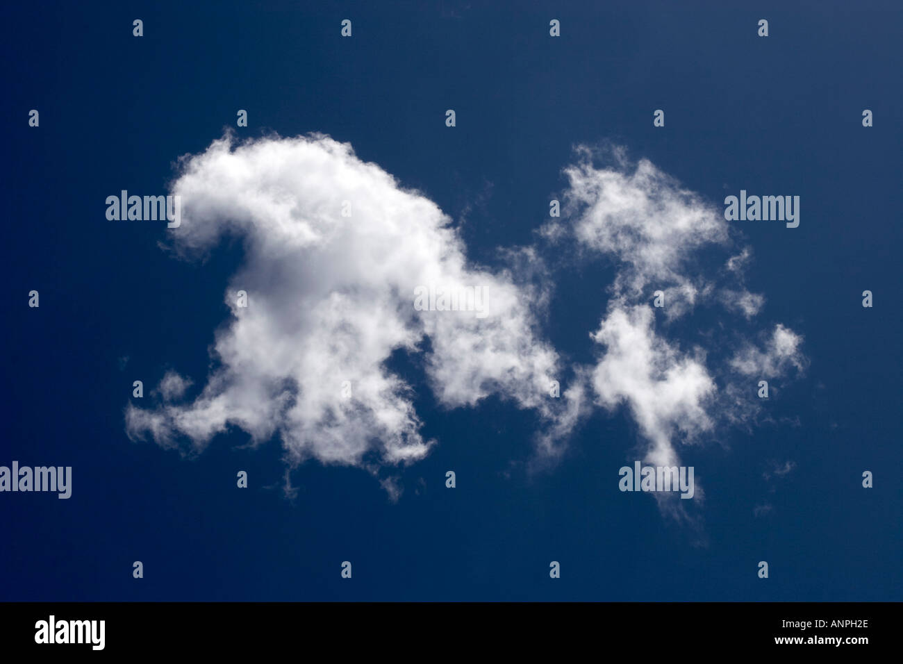 Small wisps of white cloud against blue sky Stock Photo - Alamy