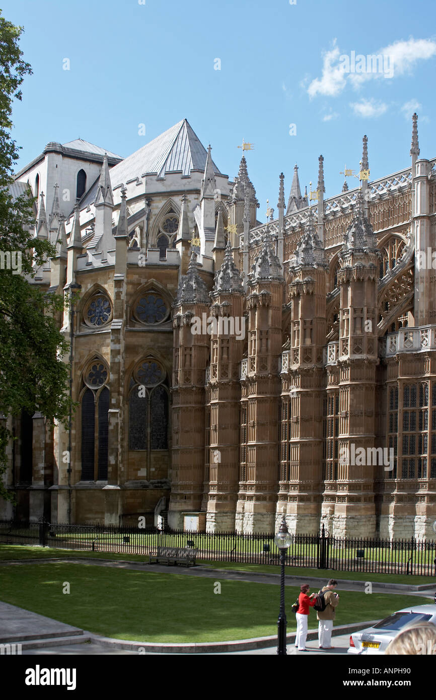 Two tourist visitors outside Westminster Abbey London SW1 England ...