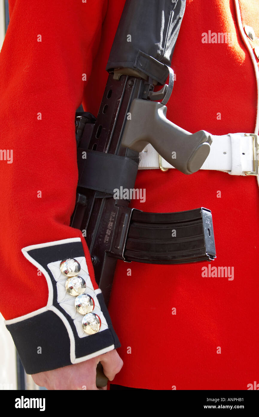 Arm and rifle of Guardsman soldier of Irish Guards on guard at St James ...