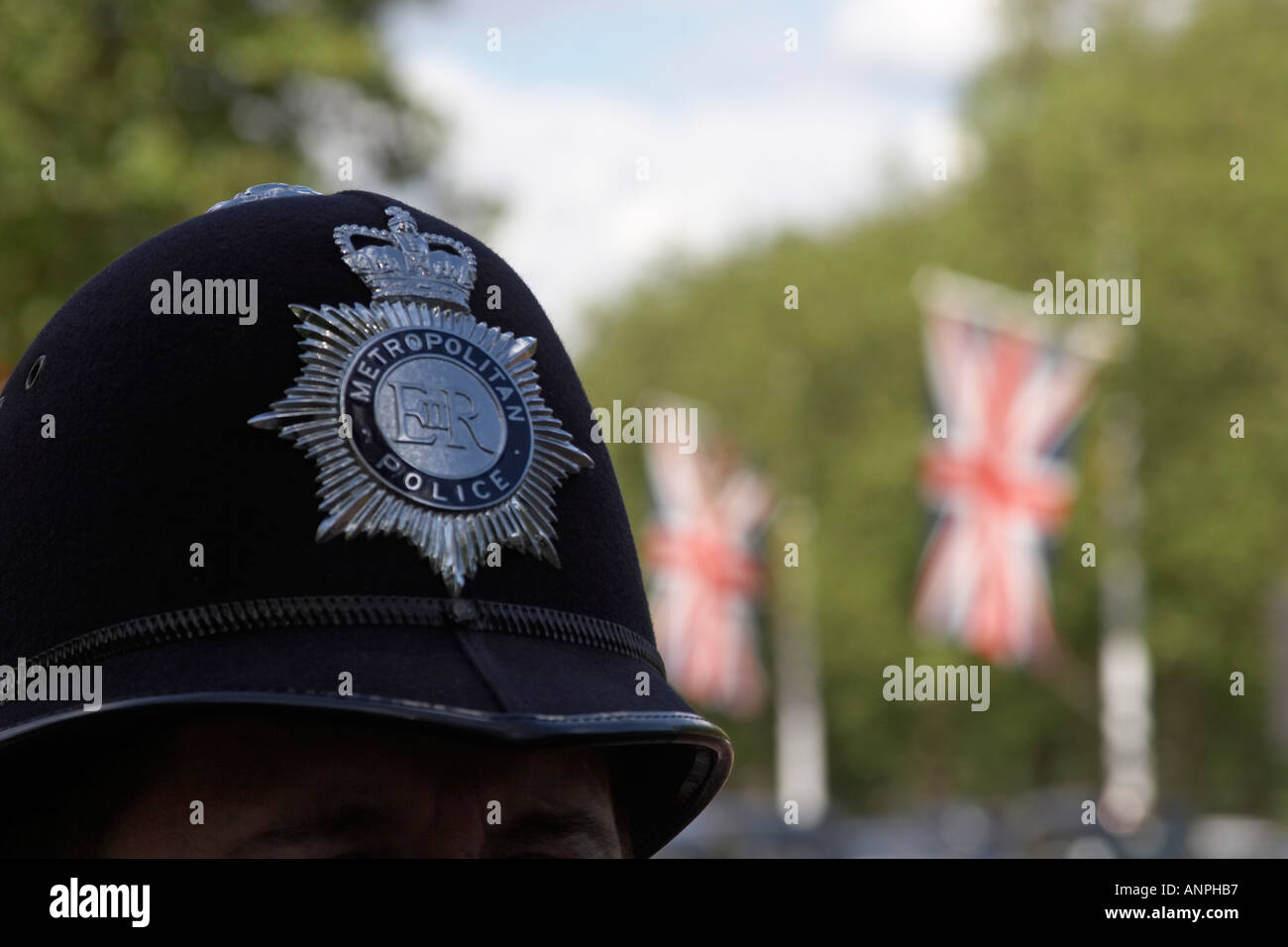 Helmet of Metropolitan Police policeman on duty with Union Jack flag on ...