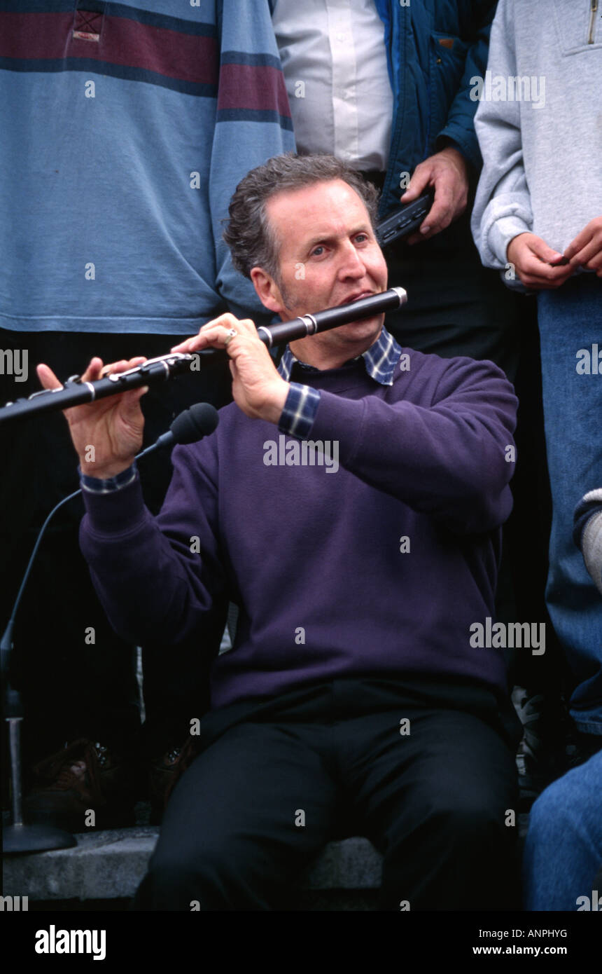 Irish musician plays flute on a street Stock Photo - Alamy