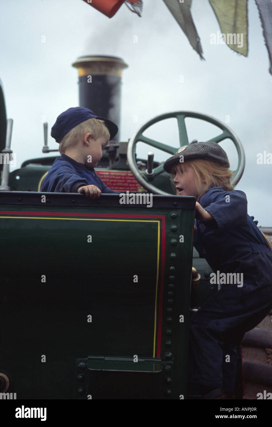 Cute Children in boiler suits on a steam tractor Upton steam rally Co ...