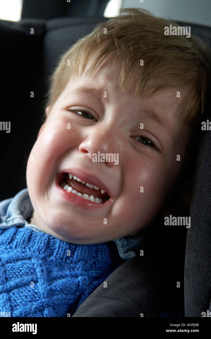 Young boy child sad crying upset and miserable England UK CJWH Stock ...