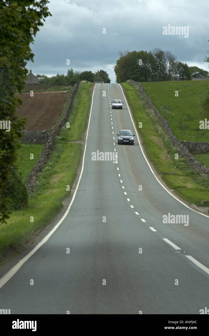 Straight road with cars traffic Peak District Derbyshire England UK ...