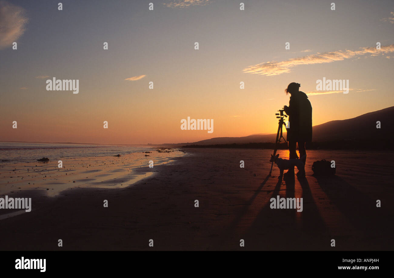photographer taking pictures in the sunset Stock Photo - Alamy