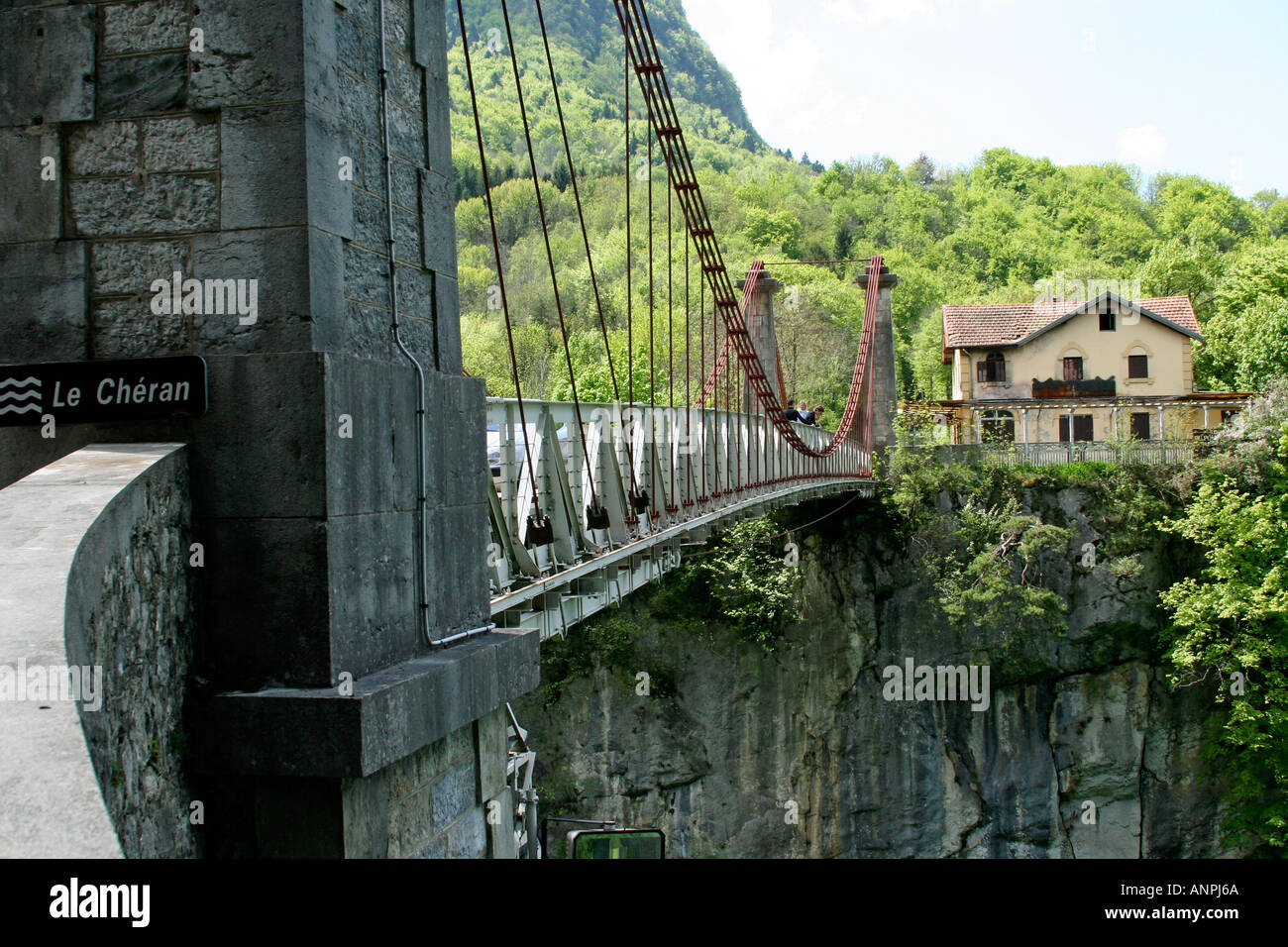 Rural country landscape with road bridge over ravine near Alby sur ...