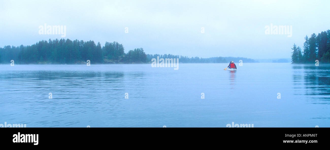 Canoeing on a Canadian lake Stock Photo - Alamy