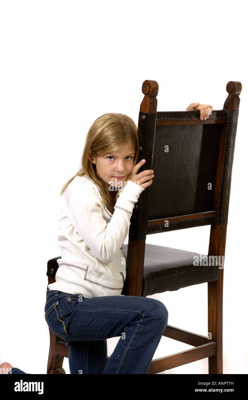 Young girl with chair Stock Photo - Alamy
