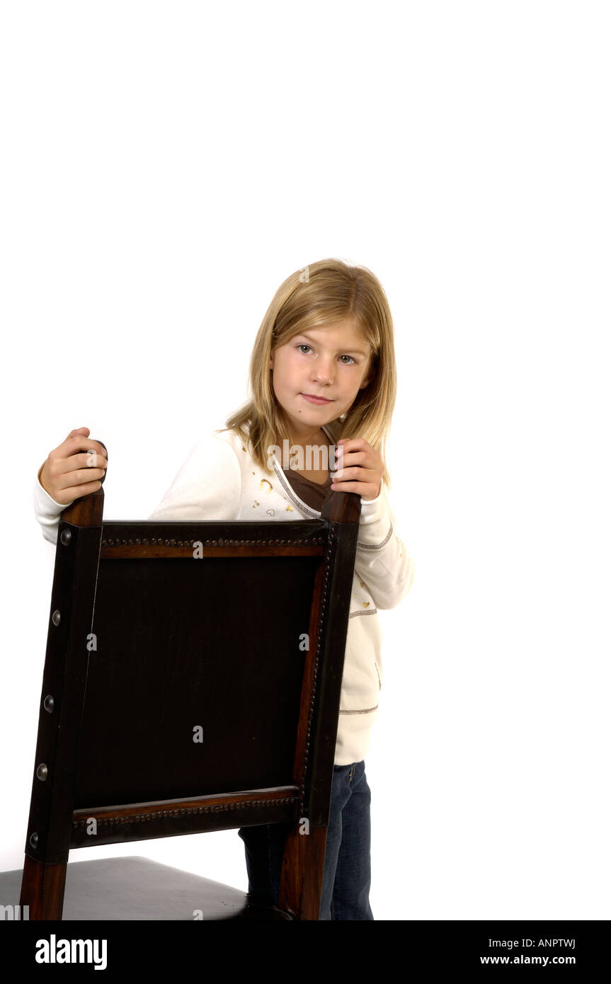 Young girl with chair Stock Photo - Alamy
