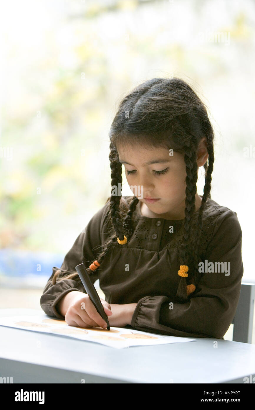 Little girl with a colouring pen Stock Photo - Alamy
