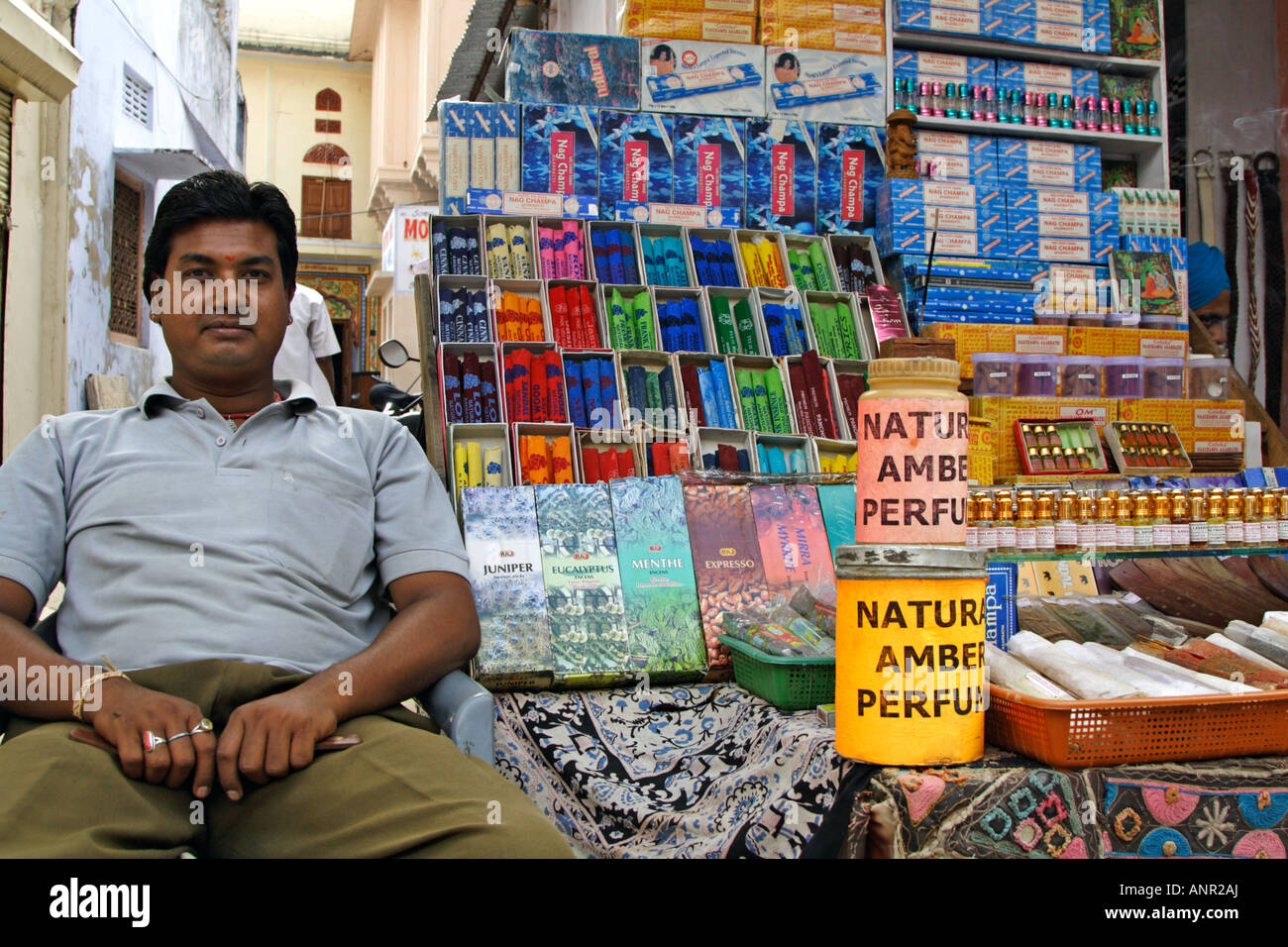 Indian man in front of his joss stick stand Stock Photo - Alamy