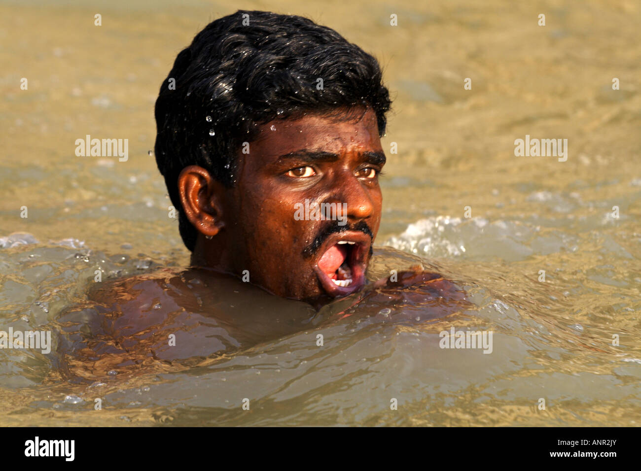 Man swimming in the Ganga river in Varanasi, India Stock Photo - Alamy