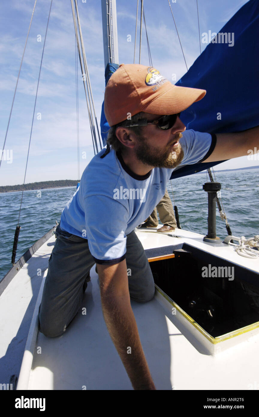Man prepares the sails for sailing in Washington the Pacific Ocean San ...