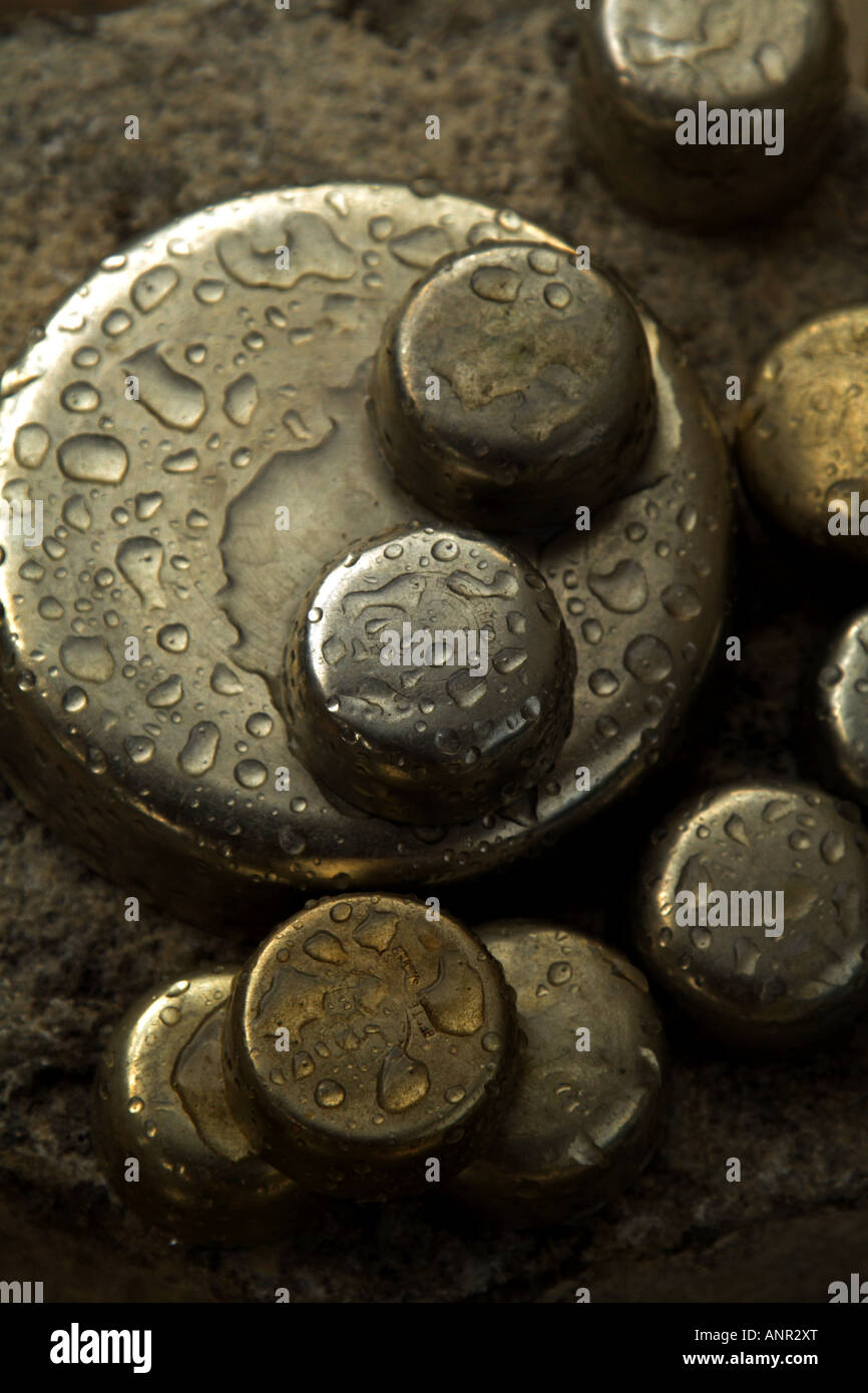 Turned metal bowls after rainfall Stock Photo - Alamy