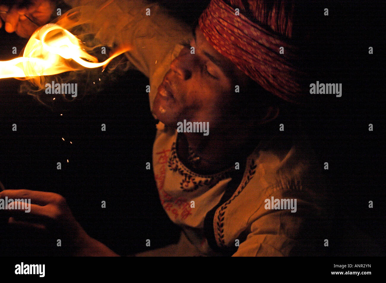 Indian fire-eater with turban Stock Photo - Alamy