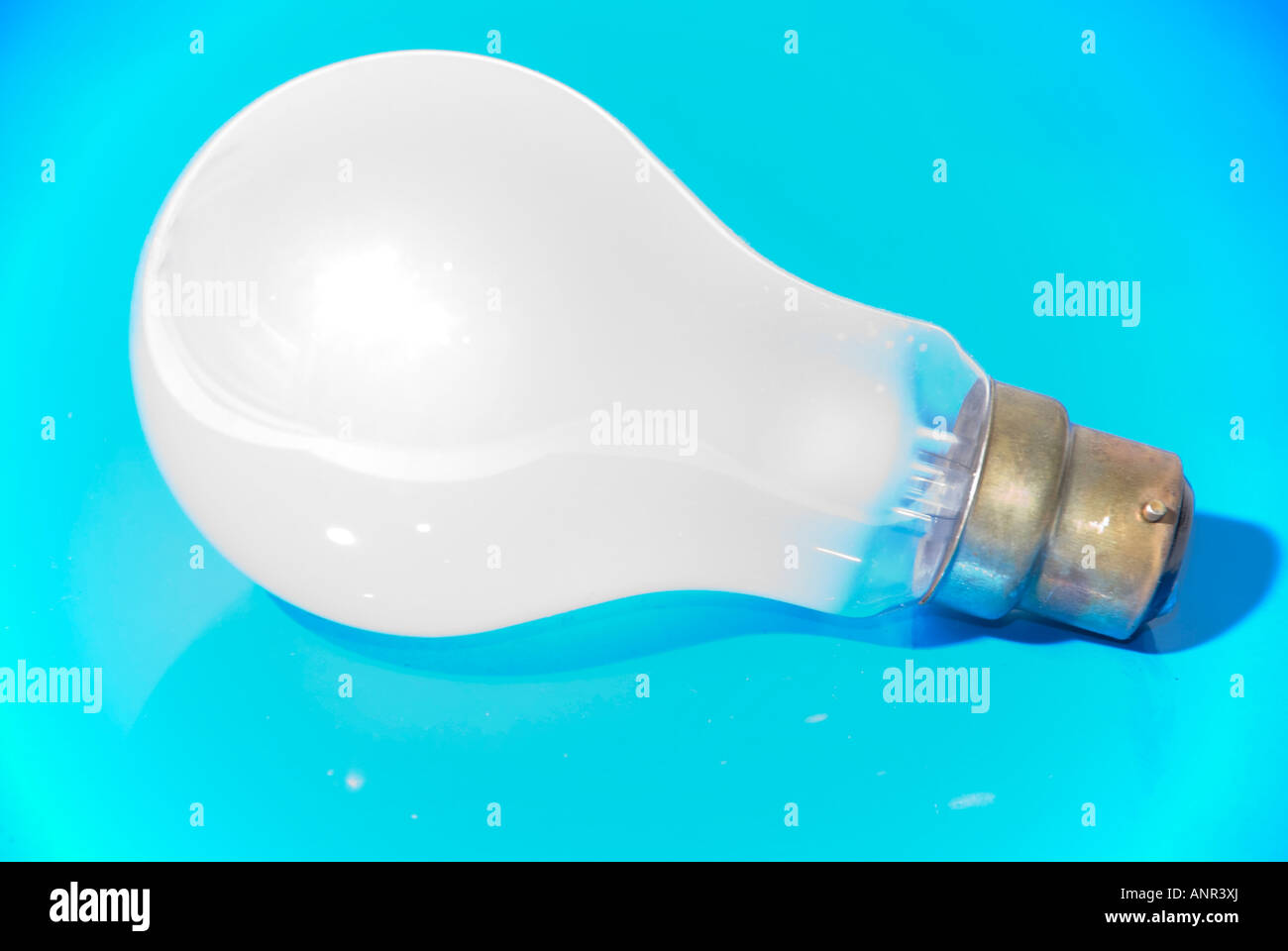 light blub on blue background Stock Photo - Alamy