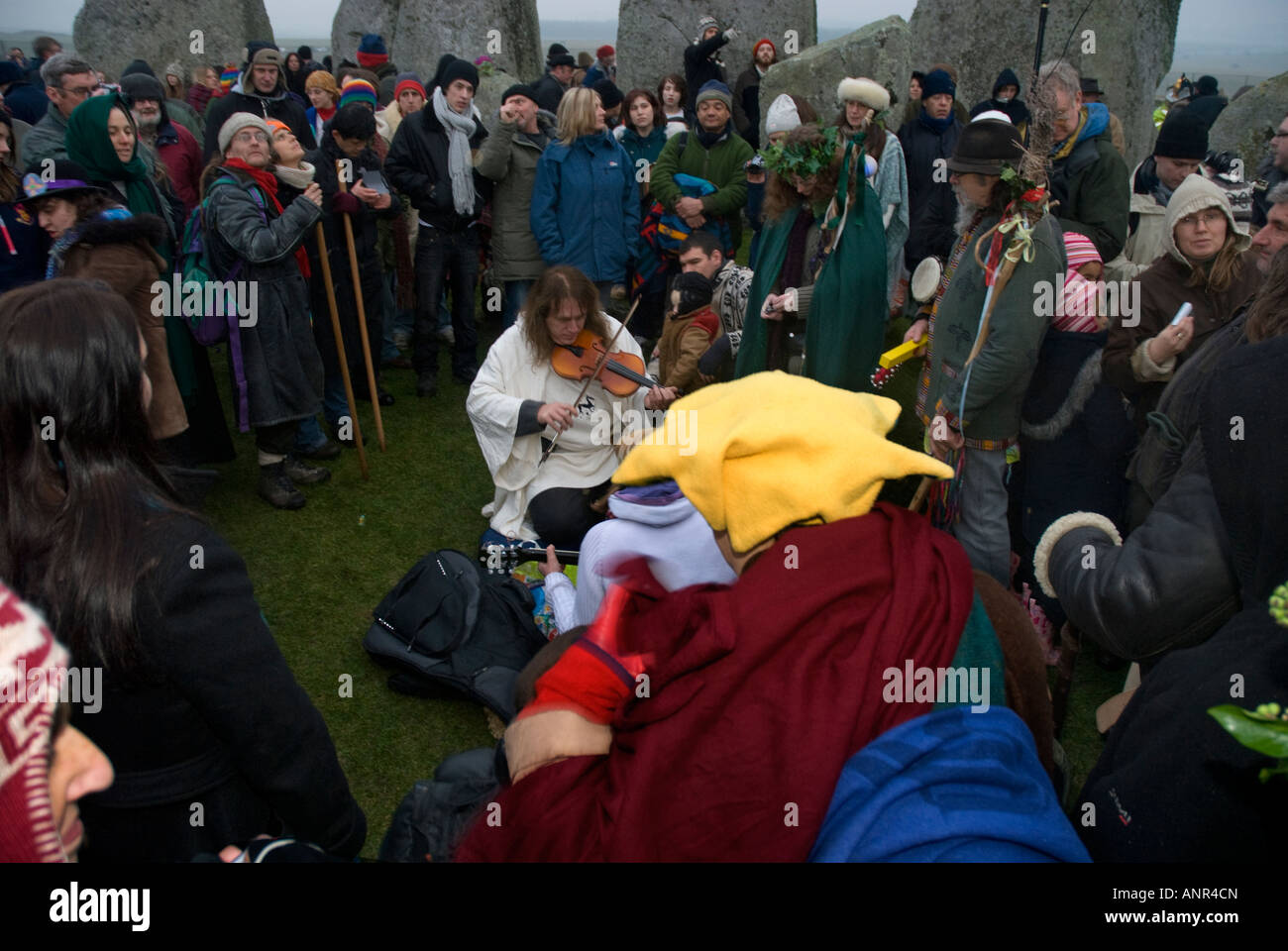 Pagan ritual in the centre of the stones at Stonehenge at sunrise ...