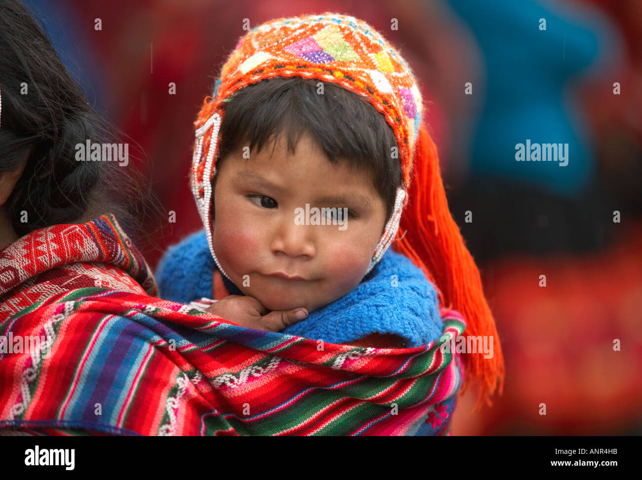 Baby on mother's back in Ollantaytambo Peru Stock Photo - Alamy