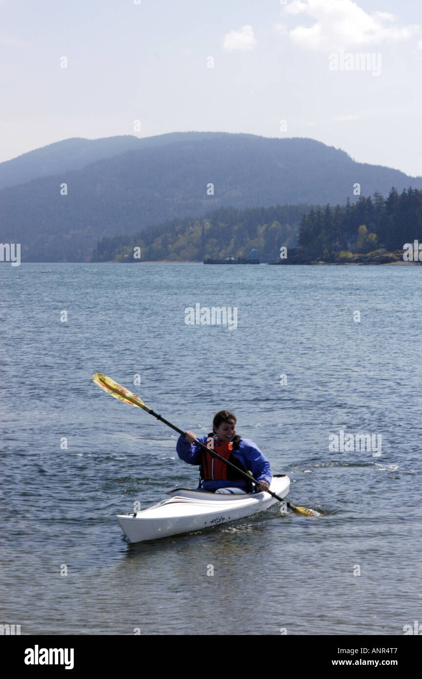 Washington San Juan Islands Woman sea kayaking near Lummi Island Stock ...